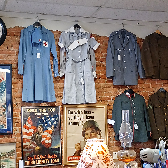 Not just uniforms, but chapters of American history hanging on brick walls beneath wartime posters that still speak to patriotic hearts.