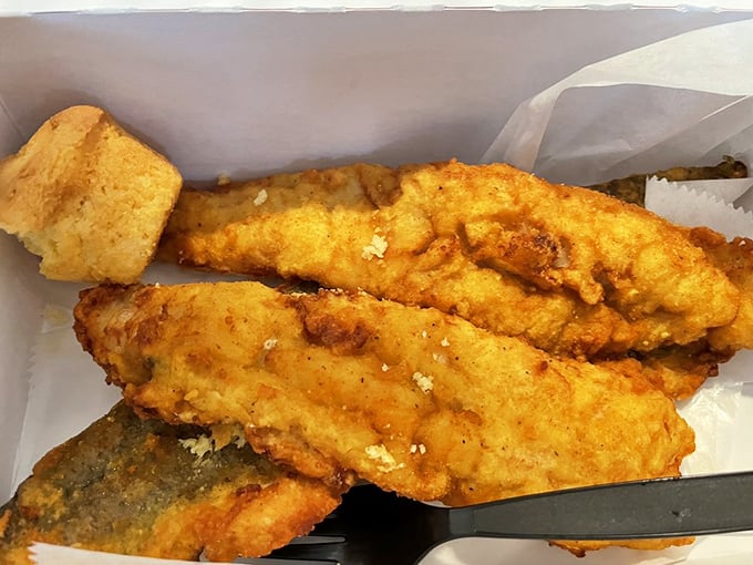 Fish that's been given the royal treatment&mdash;crispy exterior giving way to flaky perfection. The cornbread sidekick isn't just moral support.