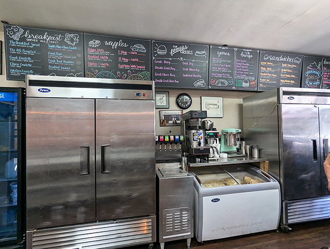 Behind the scenes magic where breakfast dreams come true. That chalkboard menu promises possibilities that stainless steel delivers.