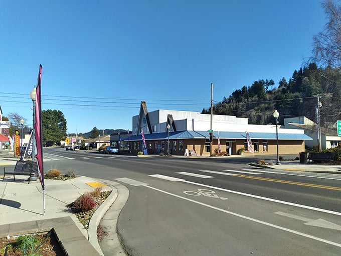 Simple storefronts and practical businesses line Reedsport's streets, reflecting the affordable lifestyle available here.