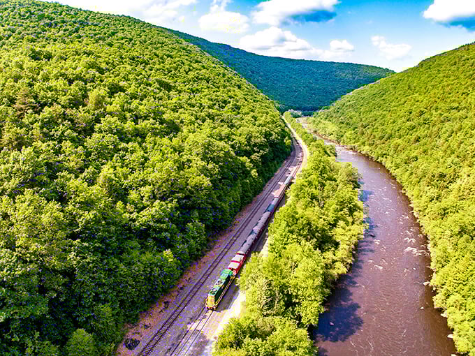 From above, the railway reveals its perfect harmony with the landscape, a thin steel thread stitching together the verdant tapestry of Pennsylvania's wilderness.