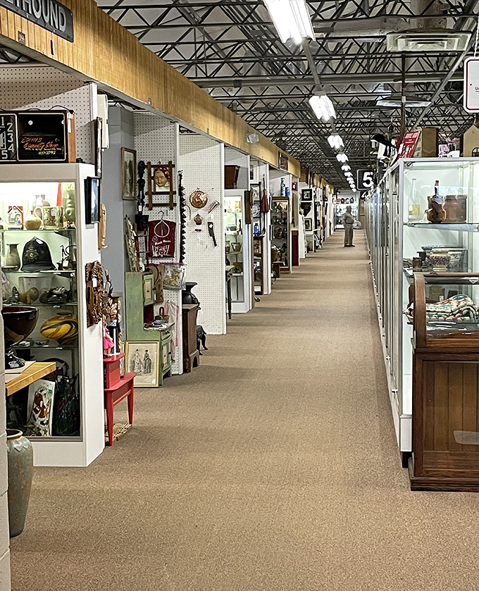 The antique mall's pristine aisles stretch toward infinity. Like a museum where "Do Not Touch" has been gloriously replaced with "Please Take Me Home."