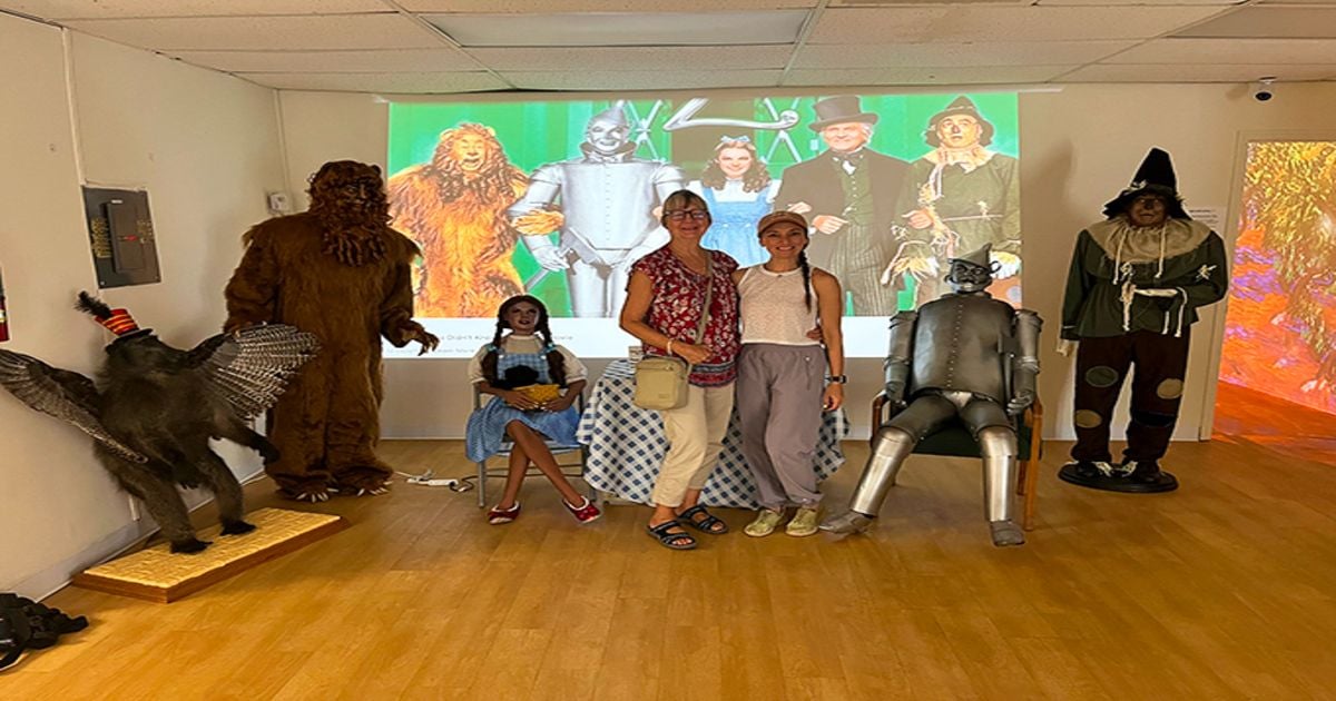 Life-sized character replicas stand ready for photos, offering visitors the chance to join the yellow brick road journey without committing to ruby slippers. 