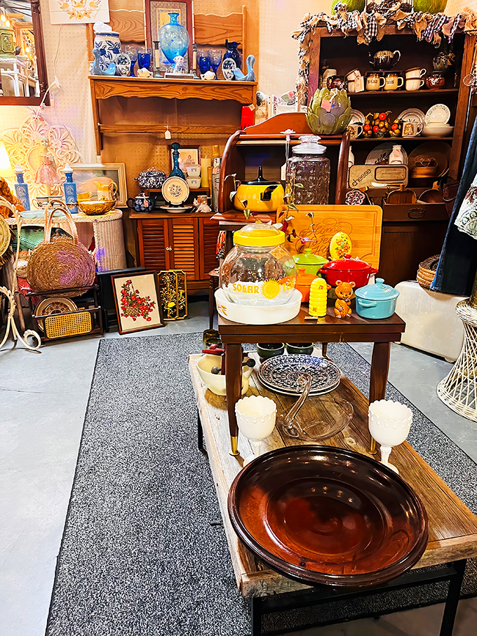 This antique booth is like a time capsule with better organization. That yellow cookie jar probably holds secrets from three generations ago.