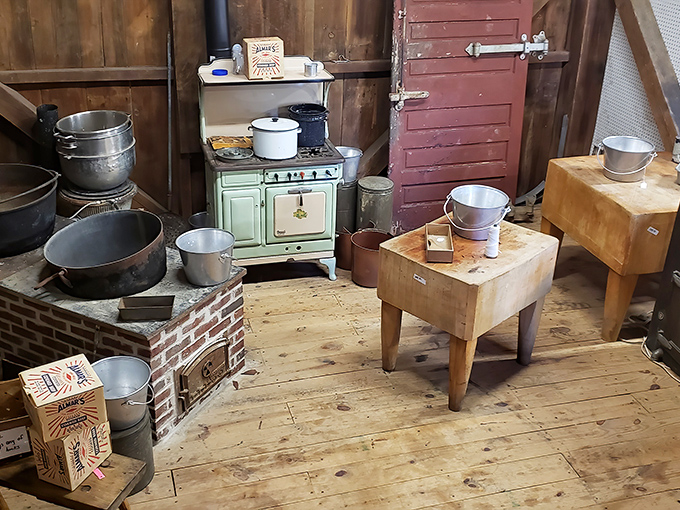 This vintage kitchen setup looks ready to whip up a hearty Pennsylvania Dutch feast. That mint-green stove has definitely seen some serious cooking.