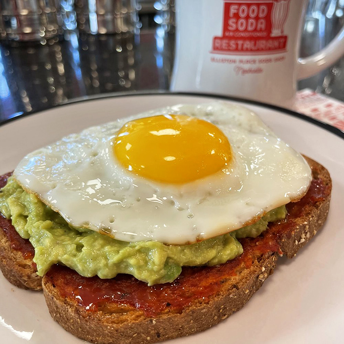 Avocado toast gets the diner treatment with a perfectly fried egg on top. Even breakfast classics make room for new traditions here.