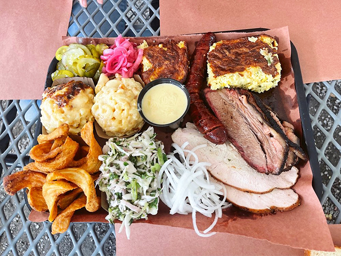 The barbecue platter that makes decision-making obsolete. Why choose one meat when this magnificent spread offers a tour of Texas in every bite?