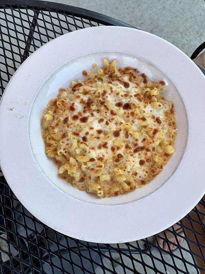 Mac and cheese that's achieved enlightenment. The golden-brown crust is like nature's way of saying, "You're welcome, humanity."