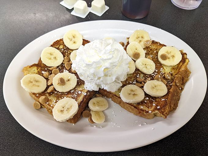 French toast that Elvis would approve of, crowned with banana slices and a cloud of whipped cream&mdash;breakfast dessert that requires no apology.