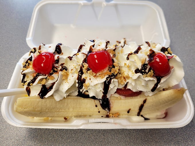 Banana split paradise: the dessert that turns adults into giddy children. This sweet finale features the classic trio of ice cream, whipped cream, and those essential cherries on top.
