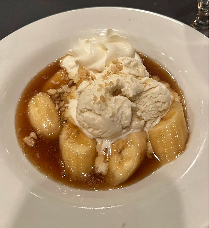 Bananas Foster's sweet, caramelized glory topped with vanilla ice cream&mdash;proof that the simplest ingredients can create the most profound pleasures.
