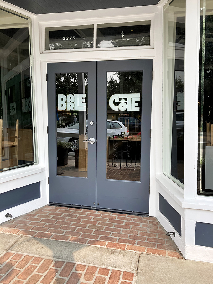 Bar Le Côte's understated entrance belies the culinary adventures within. Blue doors in wine country—a portal to seafood paradise.