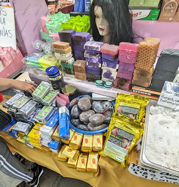 Handcrafted soaps and beauty products arranged like an aromatic rainbow. Self-care speaks every language at this fragrant display.