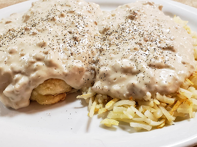 Biscuits and gravy with a side of hash browns &ndash; the breakfast of champions who plan to nap by noon. Pure, unapologetic comfort on a plate.