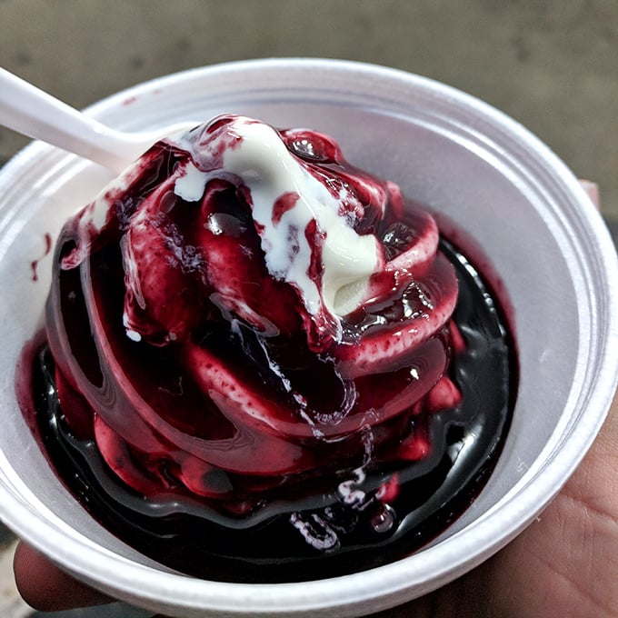 Black raspberry swirls creating abstract art that Picasso would trade his paintbrush to taste.