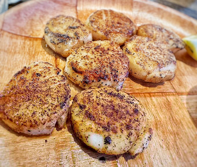 Perfectly seared scallops with that caramelized crust are the seafood equivalent of hitting the lottery. Each one is a little flavor jackpot.
