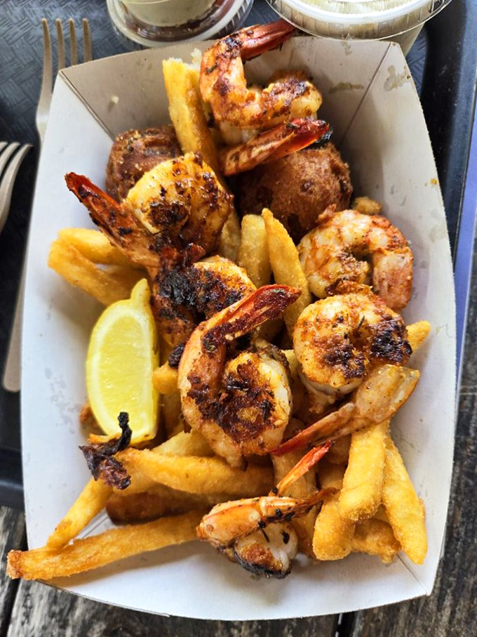 Blackened shrimp nestled among golden fries with that essential lemon wedge. This basket represents everything right about coastal Florida dining.