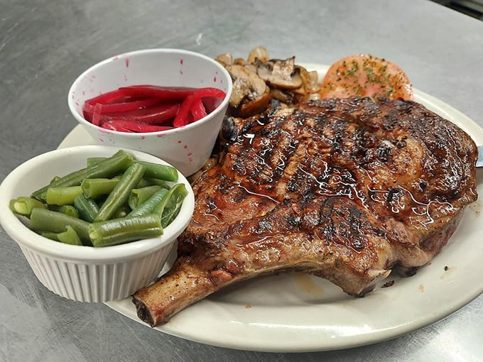 This isn't just a steak; it's a statement. Bone-in, perfectly seared, and paired with simple sides that know their supporting role in this meaty masterpiece.