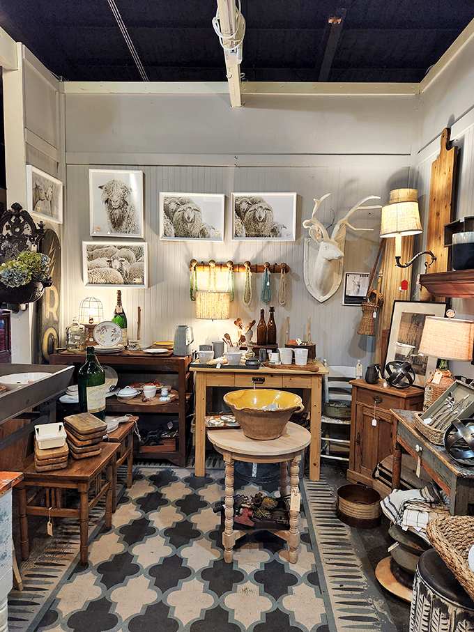 Rustic meets refined in this booth where sheep portraits and antique furnishings create a farmhouse aesthetic with unexpected sophistication.