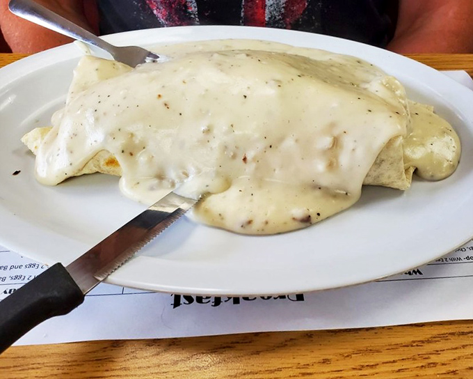 This isn't just a breakfast burrito smothered in country gravy&mdash;it's what happiness looks like before noon in the Midwest.
