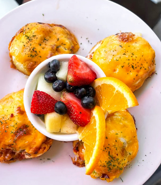 Breakfast poppers that combine the joy of melted cheese with the satisfaction of knowing fruit counts as healthy even when surrounded by carbs.