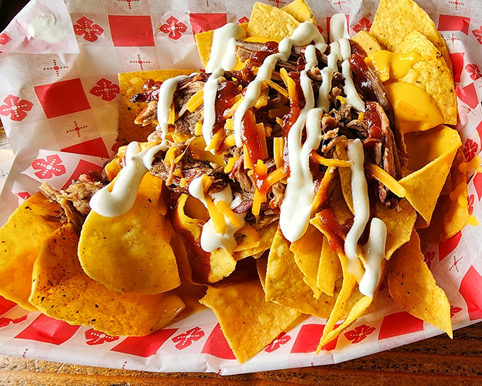 Nachos that refuse to be an afterthought, loaded with enough brisket, cheese, and sour cream to make sharing both necessary and deeply regrettable.