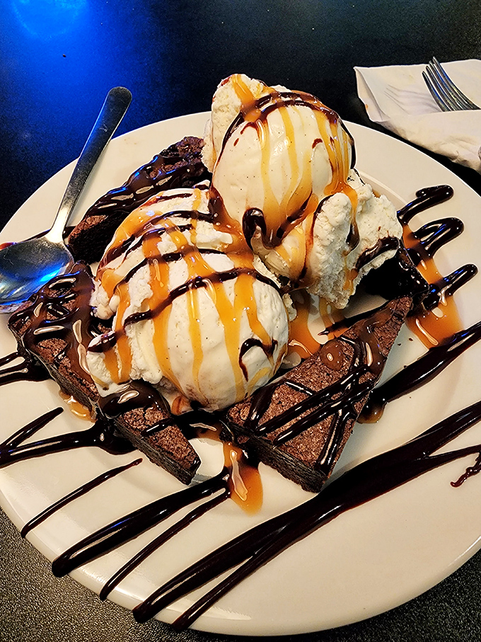 This isn't dessert&mdash;it's therapy on a plate. Warm brownie, cold ice cream, and sauces that make you question why you ever considered sharing.
