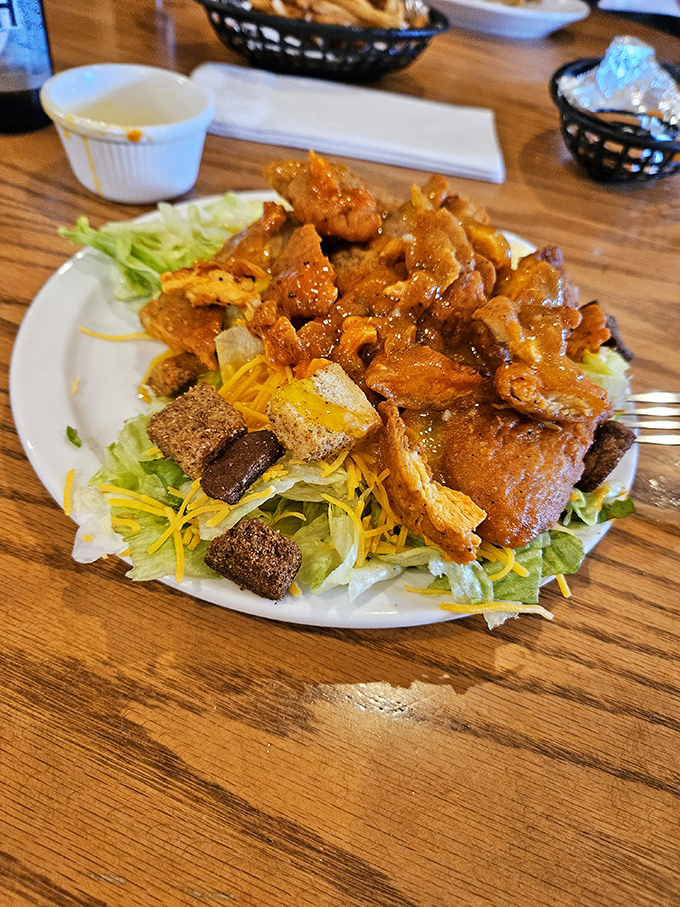 Buffalo chicken salad: where "eating healthy" meets "treating yourself." Crispy chicken, fresh greens, and that signature sauce create the perfect compromise.