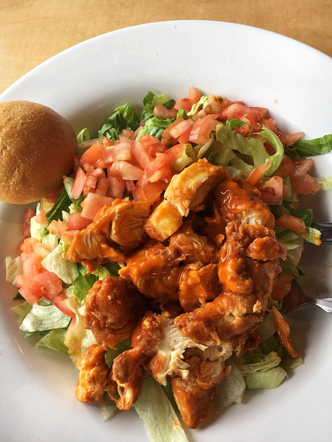 Buffalo chicken goes upscale! This vibrant salad proves Gino's isn't just about burgers&mdash;their spicy buffalo chicken adds kick to fresh greens for a meal that feels almost virtuous.