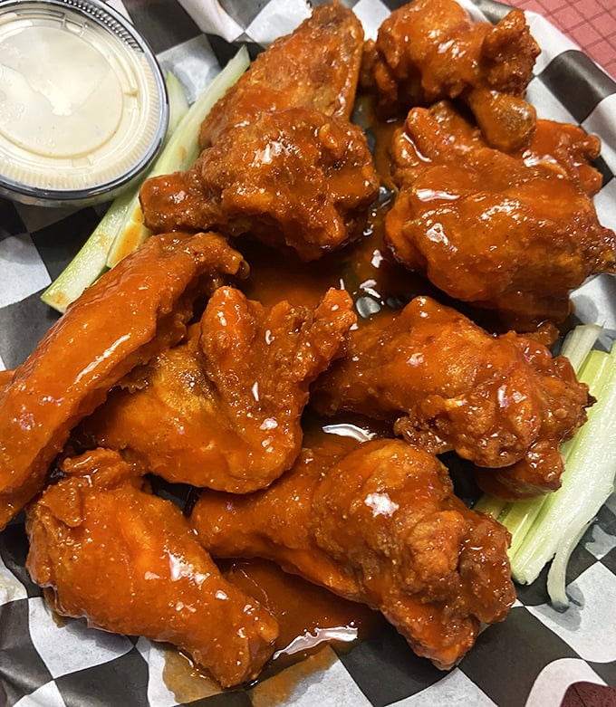 Buffalo wings with attitude&mdash;saucy, spicy, and unapologetically messy. Your shirt may not survive, but your taste buds will thank you.