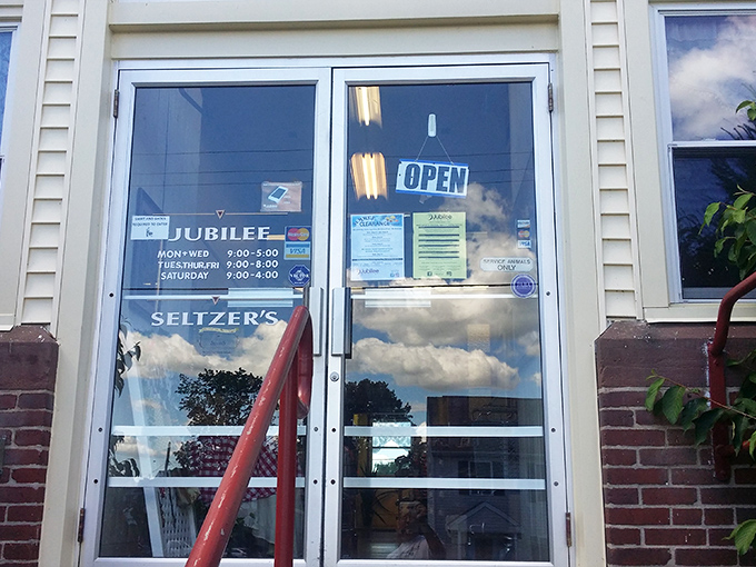 Business hours posted clearly, because knowing when paradise opens is essential for serious shoppers.