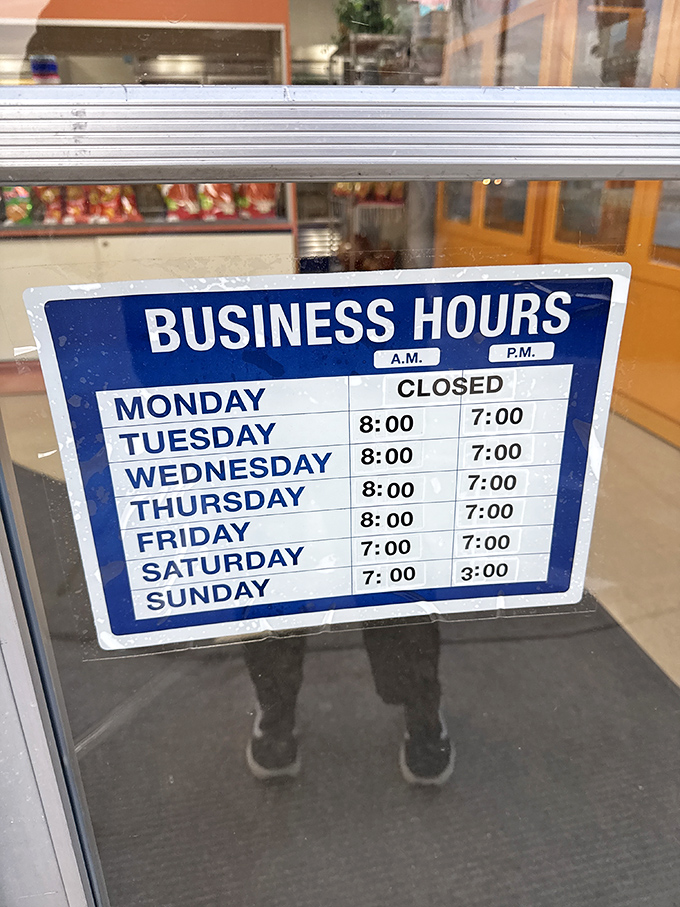 The business hours sign: a roadmap to tamale happiness. Note they're closed Mondays&mdash;even tamale artisans need a day off.