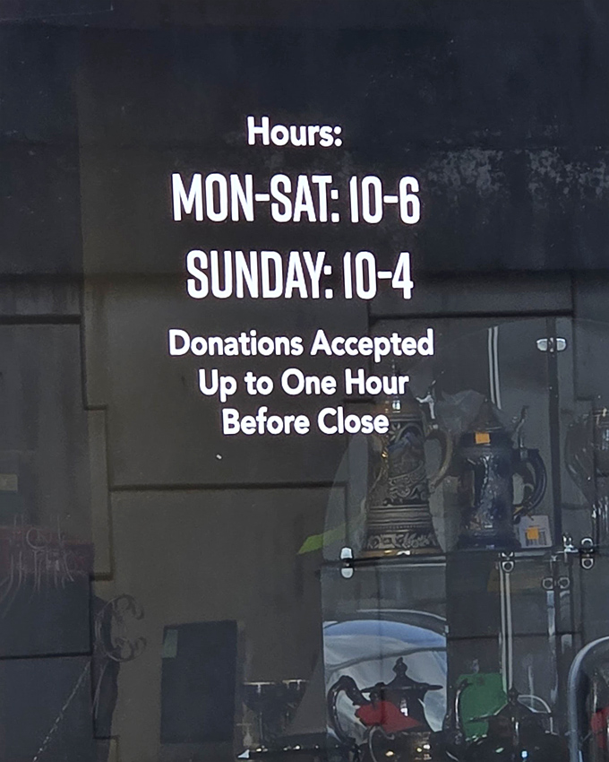 The hours sign is like a treasure map with clear instructions. Donations accepted until one hour before close&mdash;keeping the cycle of giving spinning.