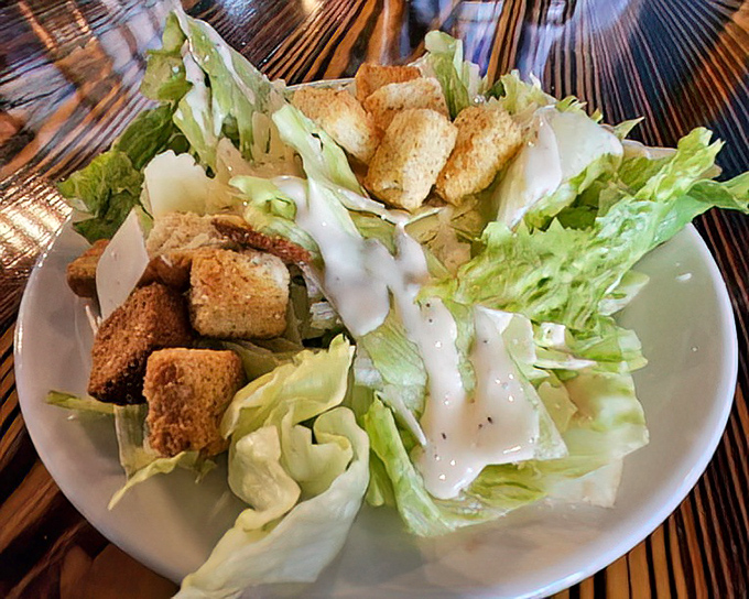 Caesar salad done right &ndash; crisp romaine, proper dressing, and those crunchy croutons that make all the difference.