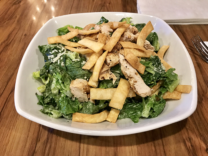 A Caesar salad that doesn't apologize for the addition of fries&mdash;because sometimes vegetables need carb companions to reach their full potential.