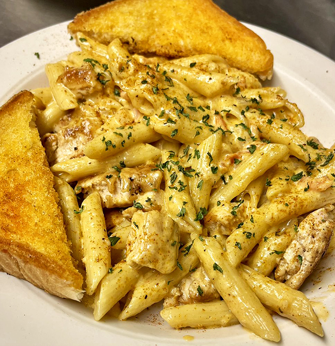 Pasta that doesn't need a passport to deliver international flavor. That golden garlic toast is the perfect companion for sauce-scooping.