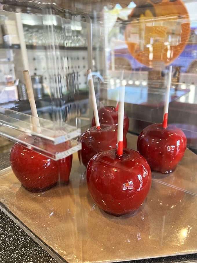 Candy apples so perfectly glossy they look like they should be in a fairy tale, warning Snow White about the dangers of accepting food from strangers.