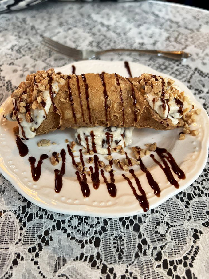 The cannoli&mdash;a sweet punctuation mark at the end of a perfect meal. Crisp shell, creamy filling, and chocolate drizzle create the dessert trifecta.