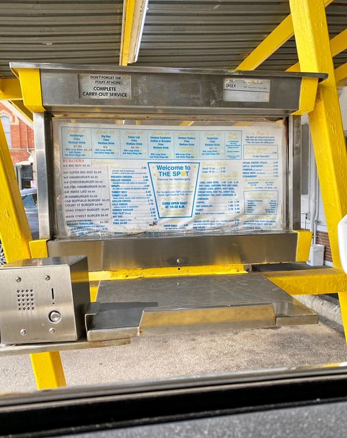 The drive-thru menu board stands as a relic of car culture's golden age, when dinner could be ordered through speakers without apps.