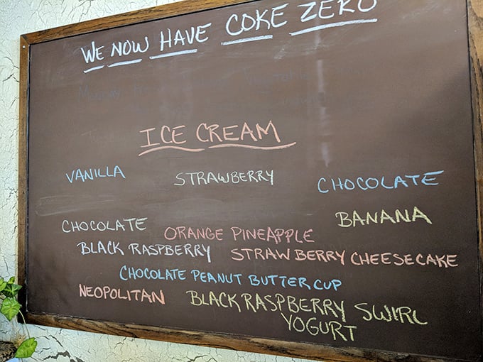 The chalkboard ice cream menu—where decisions become deliciously difficult. Black raspberry swirl yogurt or chocolate peanut butter cup? Life's important questions.