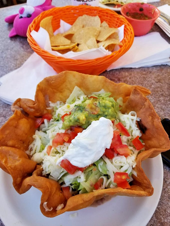 The humble chalupa transformed into an edible art form&mdash;a crispy, boat-shaped canvas painted with layers of lettuce, cheese, tomatoes, and creamy guacamole.