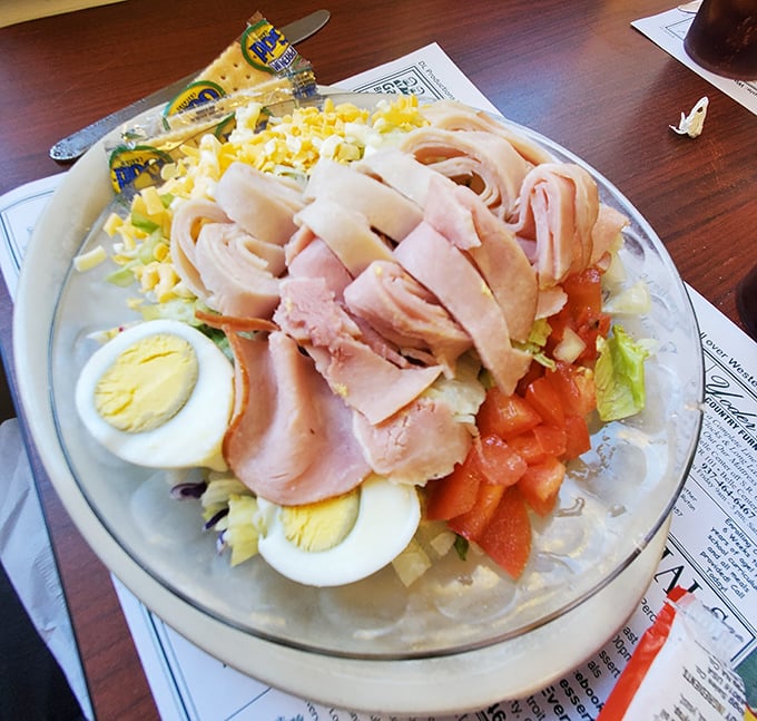 A chef salad that actually satisfies—protein-packed with ham, eggs, and cheese proving that "eating light" doesn't have to mean going hungry.