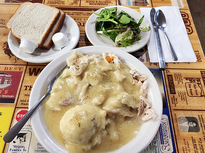 Chicken and dumplings that could end family feuds. Pillowy dumplings swimming in broth that's worth the drive from three counties away.