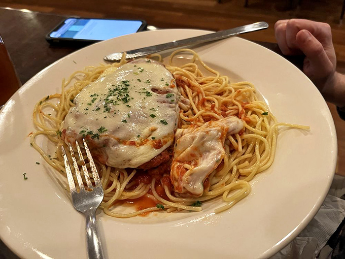 This chicken parmesan doesn't just sit on its pasta throne&mdash;it reigns supreme, melted cheese crown and all, ready for its fork-twirling close-up.