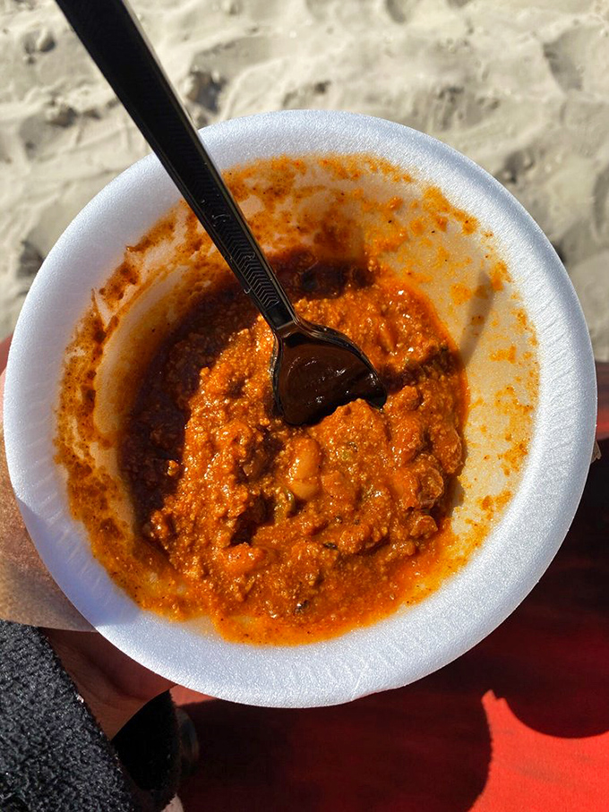 A bowl of spicy goodness that proves the best things in life come in Styrofoam containers on sandy beaches.