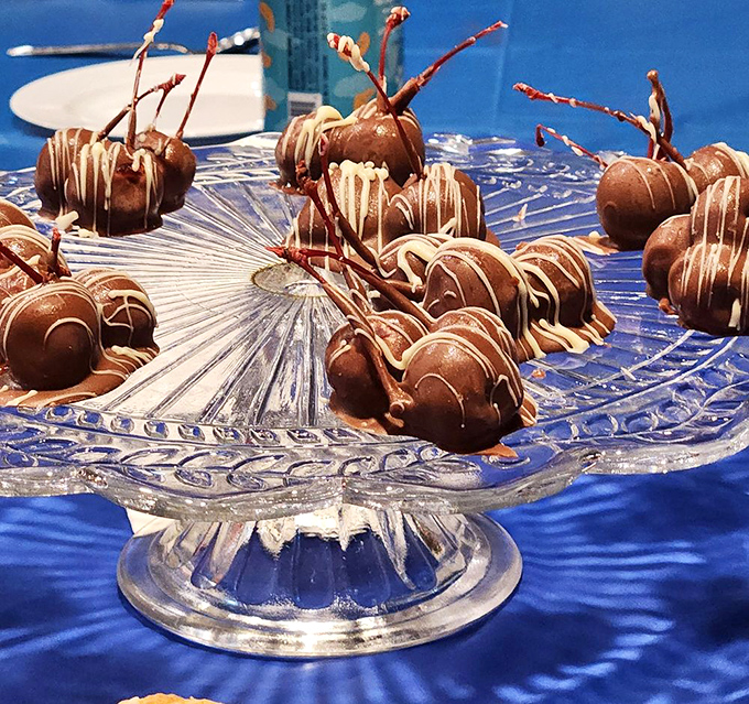 Chocolate-covered cherries on a crystal pedestal – proof that sometimes the classics deserve the spotlight too.