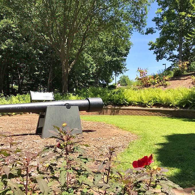 This Civil War cannon stands guard over manicured gardens, a powerful reminder of Atlanta's complex and layered history.