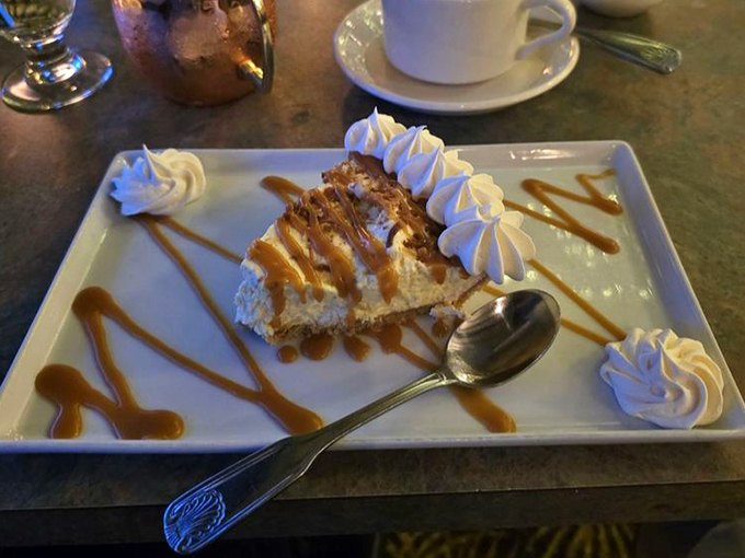 This coconut cream pie slice, artfully drizzled with caramel, isn't just dessert&mdash;it's the finale your taste buds have been waiting for.