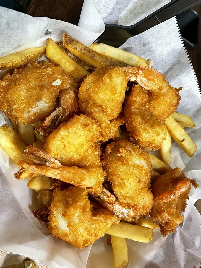 Golden-battered shrimp that crunch like autumn leaves—if autumn leaves tasted like the ocean's finest offerings.