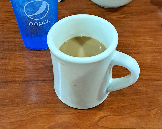 That classic white diner mug&mdash;holding what might be the most honest cup of coffee in Pennsylvania, no pretension, just pure caffeinated comfort.